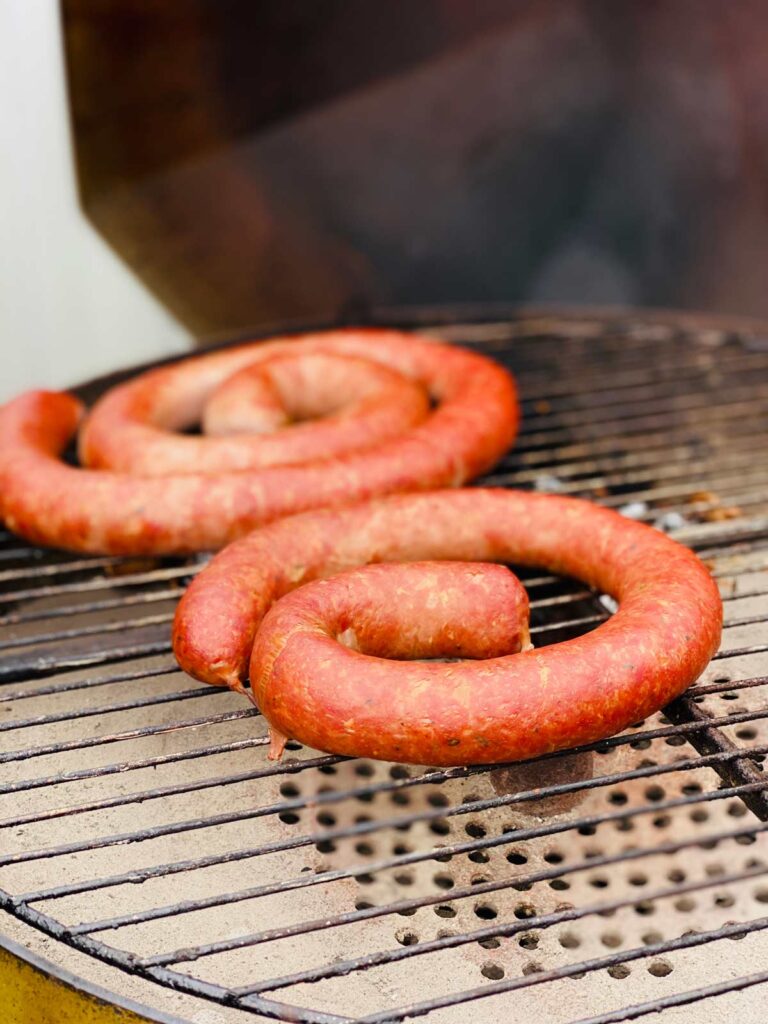Homemade mici - the famous Romanian garlicky meat open sausages